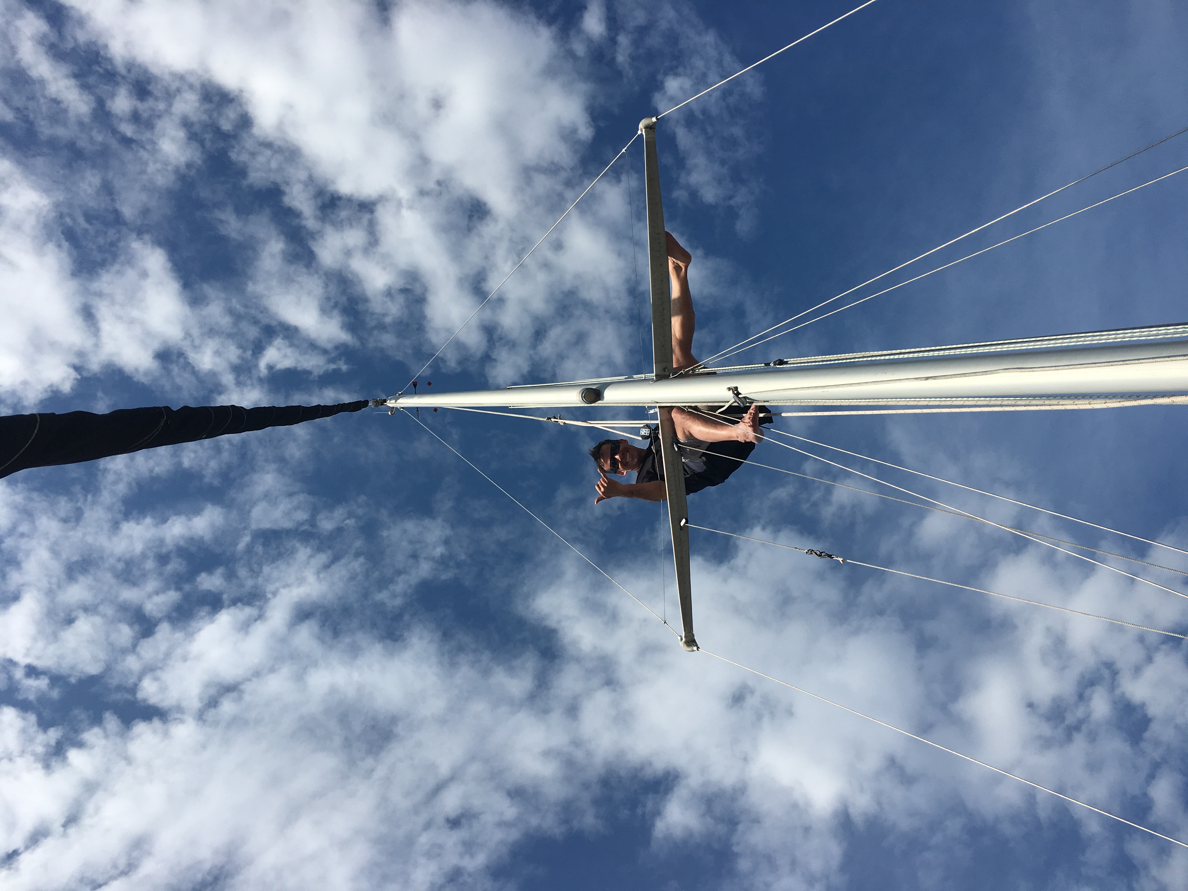 Going aloft to check and replace navigation lights. – Viento Sailing